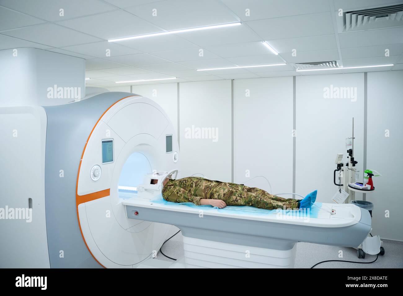 Military patient prepared for MRI of brain in scanning room Stock Photo ...