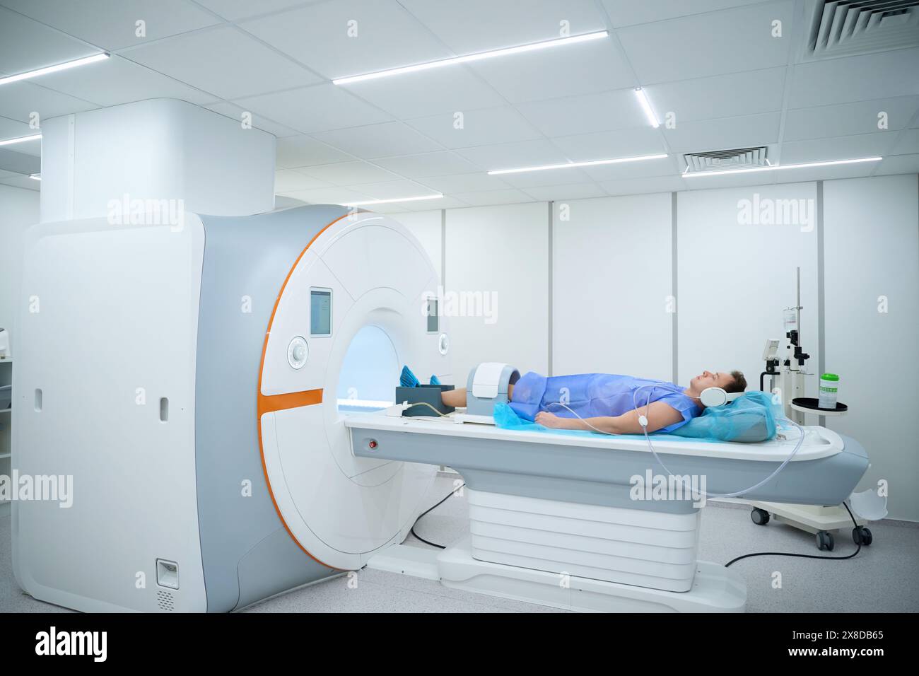 Man prepared for magnetic resonance imaging of lower extremity joint ...