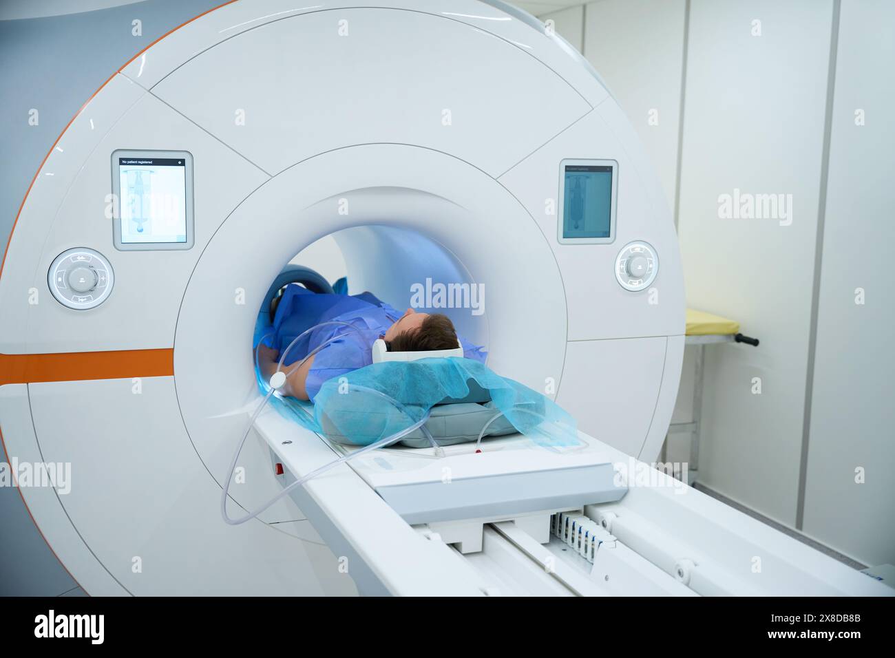 Adult patient is undergoing magnetic resonance imaging of lower limb ...