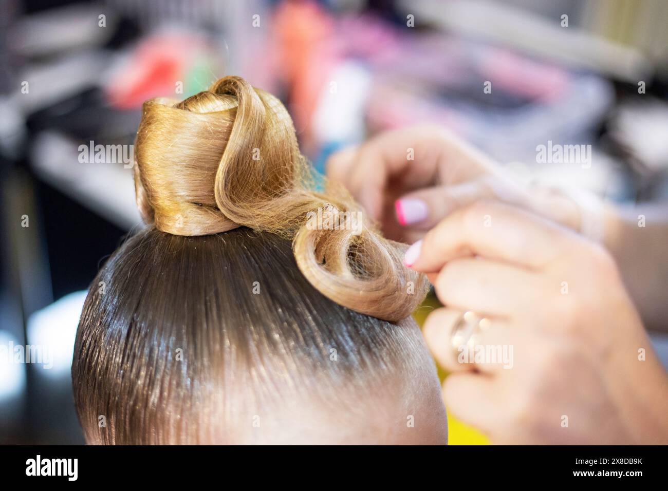 stylist to create a fashionable ponytail hairstyle for a ballroom ...
