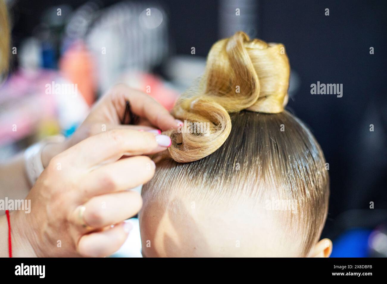 stylist to create a fashionable ponytail hairstyle for a ballroom ...