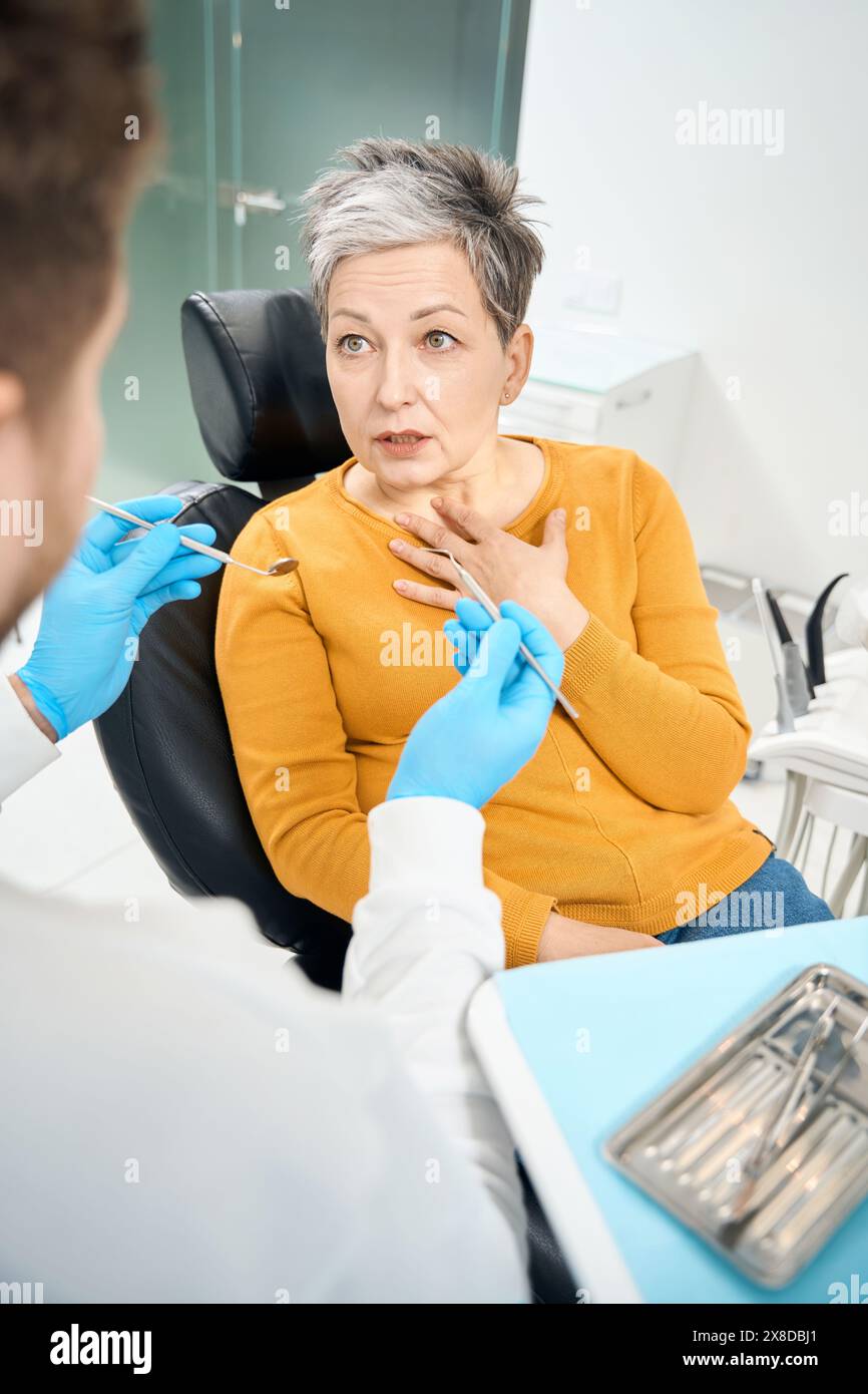 Woman hands scared dental hi-res stock photography and images - Alamy