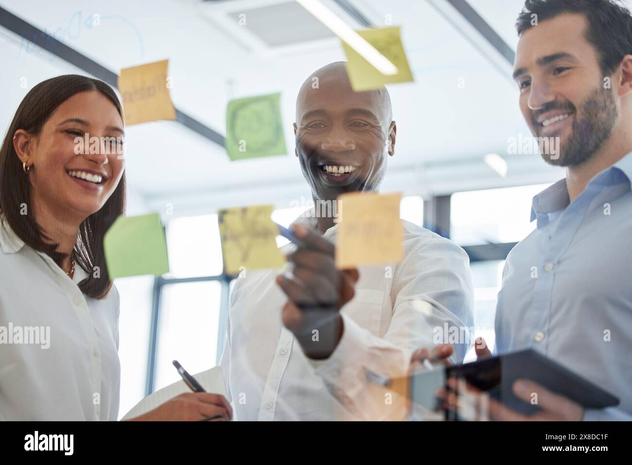 Glass, sticky note and business people with meeting by board for kpi ...