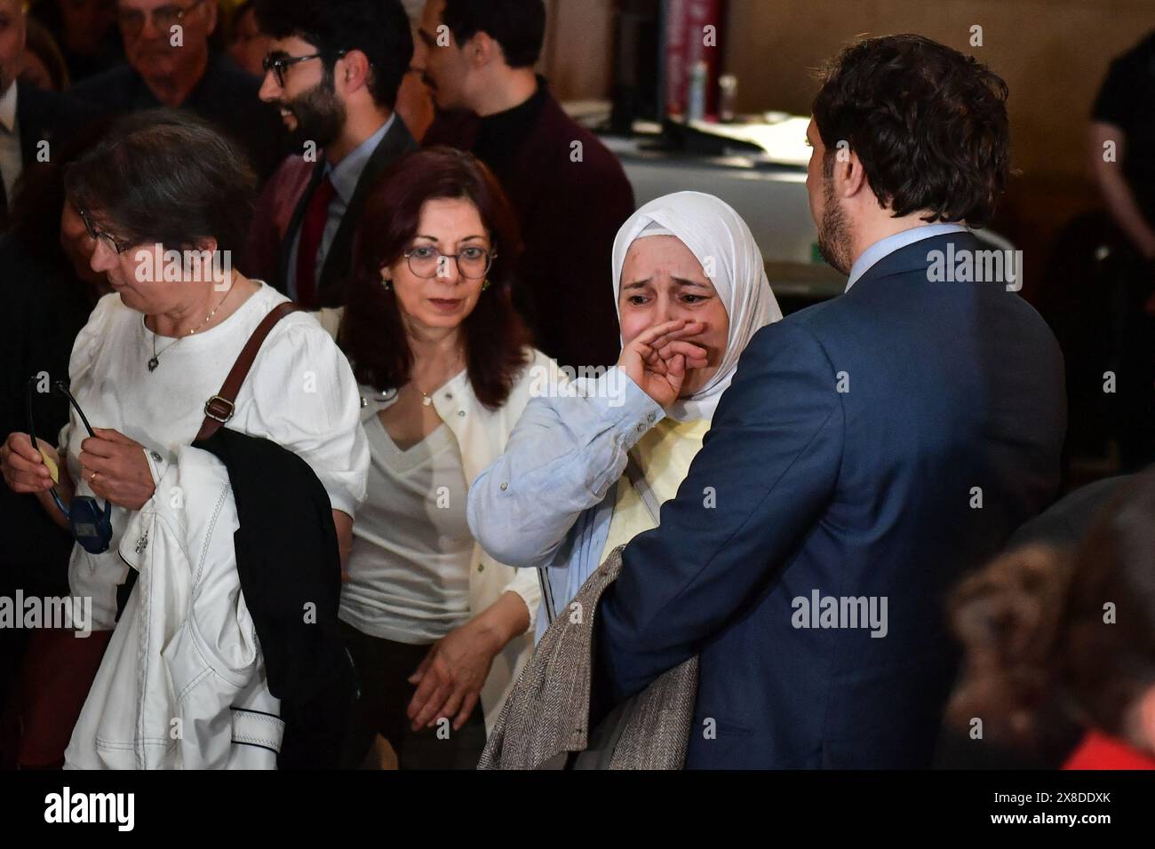 Attendees react as a trial in absentia ended with a life imprisonment ...