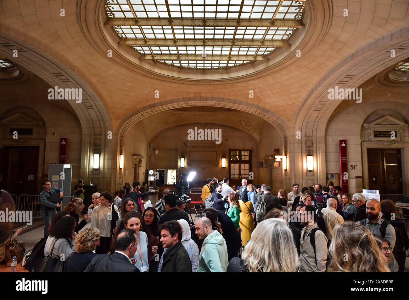 Attendees react as a trial in absentia ended with a life imprisonment ...