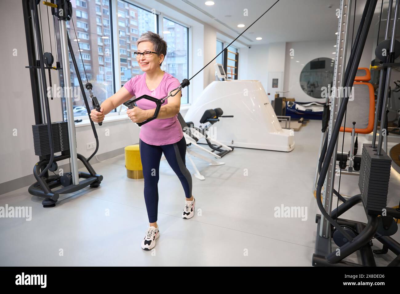 Caucasian woman doing chest exercise hi-res stock photography and ...