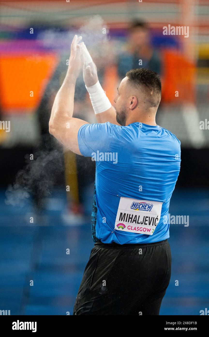 competing in the men’s shot put at the World Athletics Indoor ...