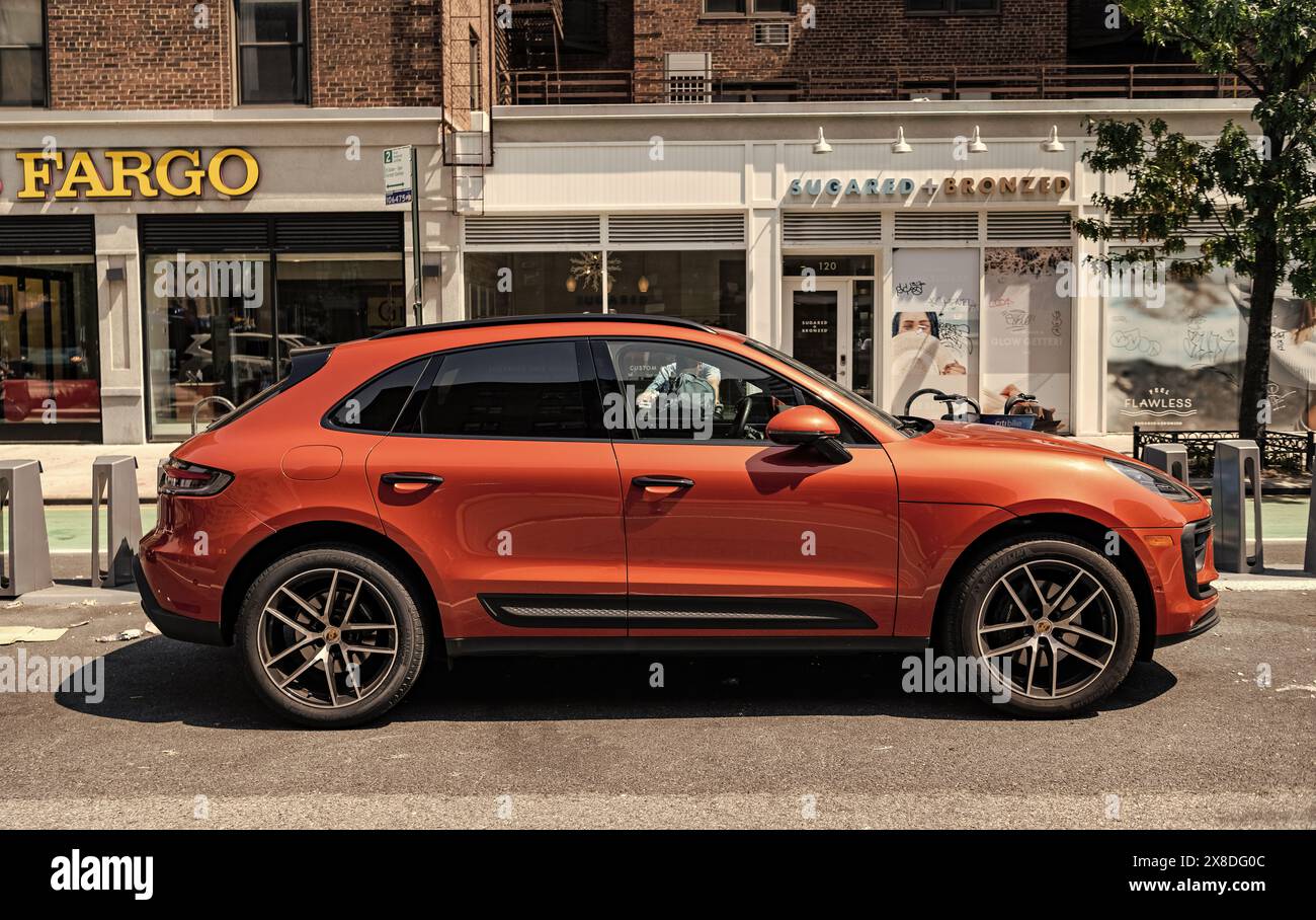 New York City, USA - August 05, 2023: 2023 Porsche Macan T SUV Ruby red ...
