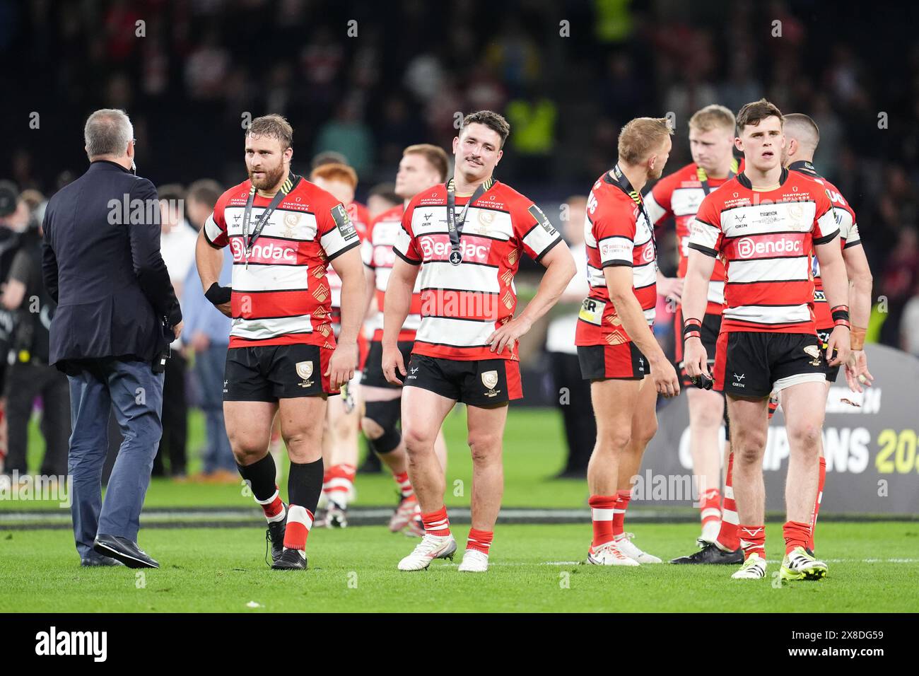 Gloucester Rugby's Santiago Socino (centre) and team-mates stand ...