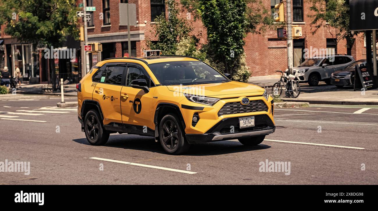 New York City, USA - August 05, 2023: 2019 Toyota RAV4 SUV yellow car ...