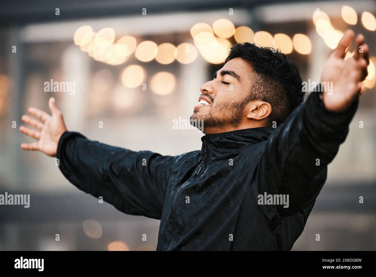Outdoor, happiness and freedom of man for rain, spring weather and ...