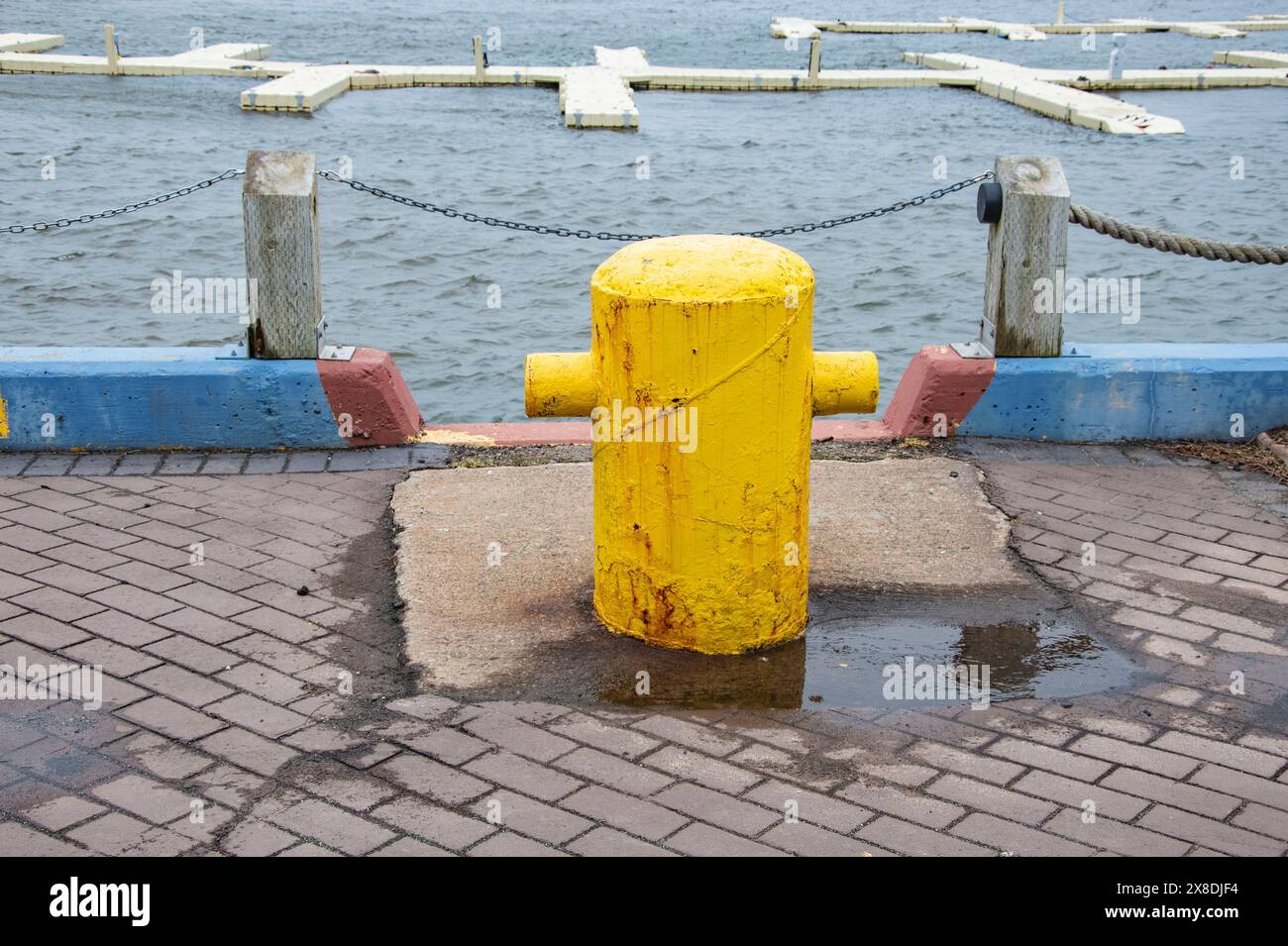 Yellow bollard at the marina in Charlottetown, Prince Edward Island ...