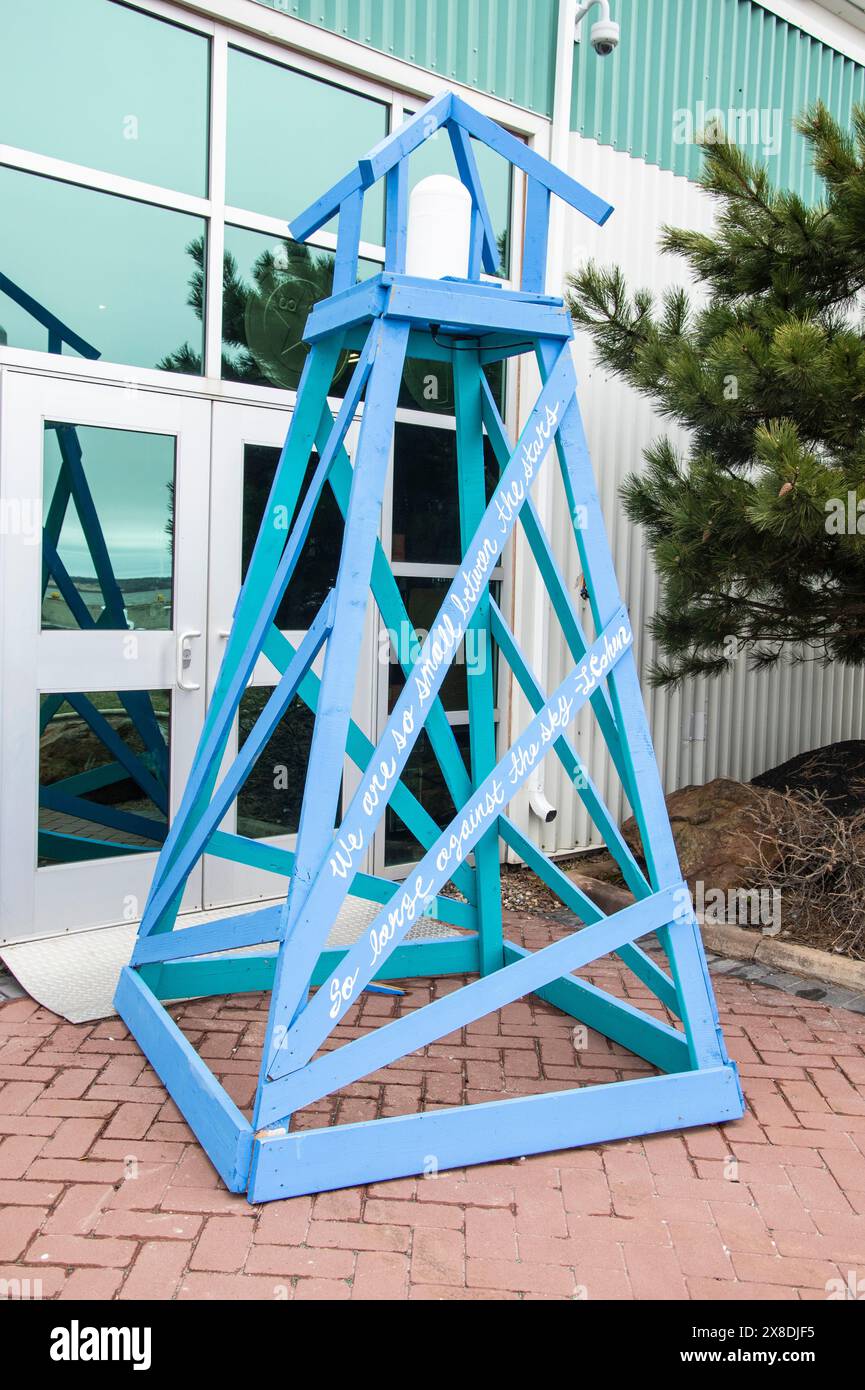 Decorative blue lighthouse structure with messages at the wharf in ...