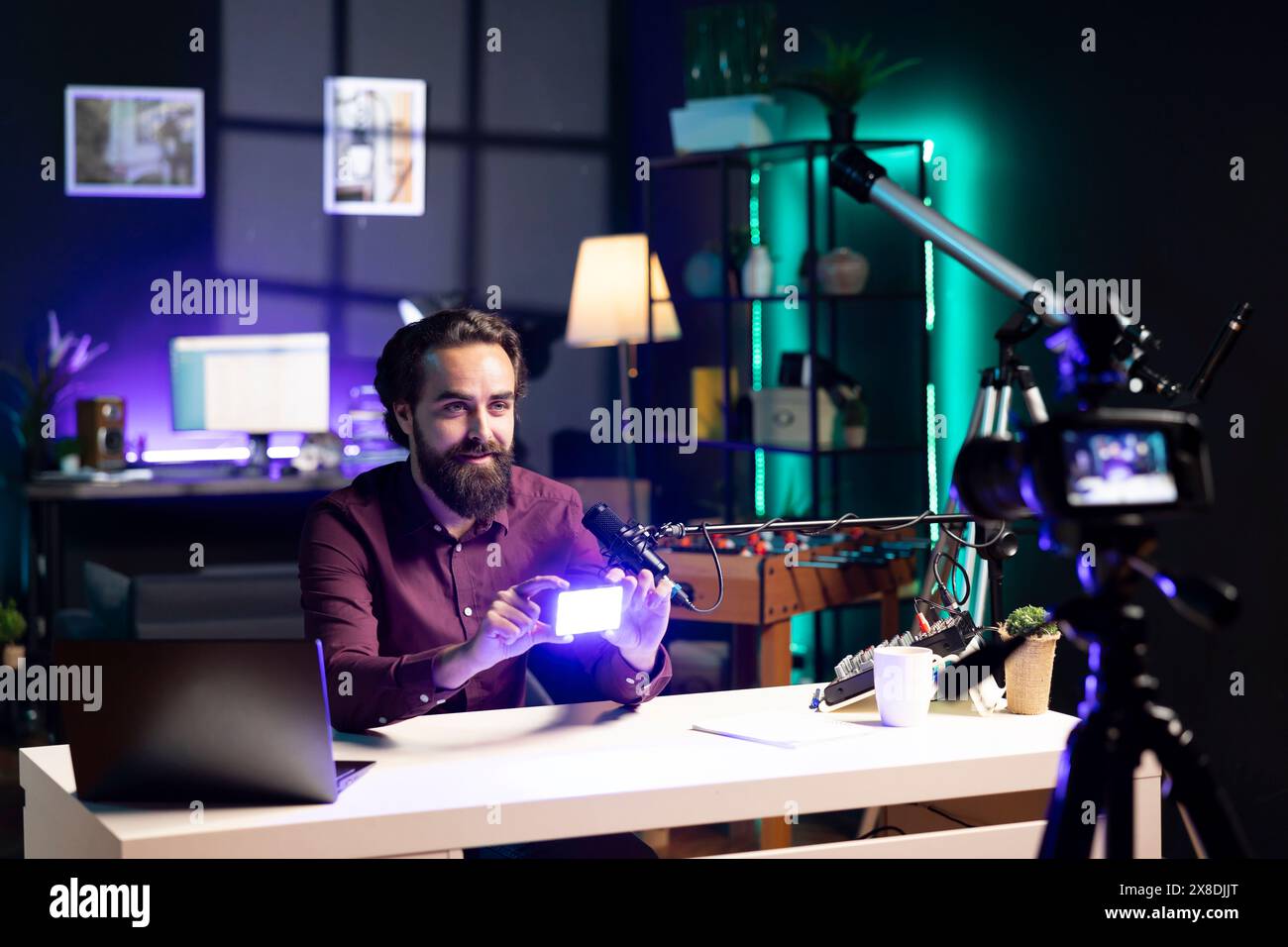 Happy tech expert filming technology review of mini led lights using ...