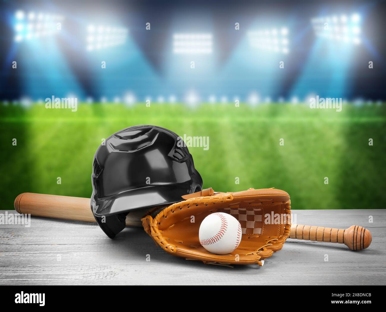 Baseball bat, glove, helmet and ball on wooden table at stadium Stock ...