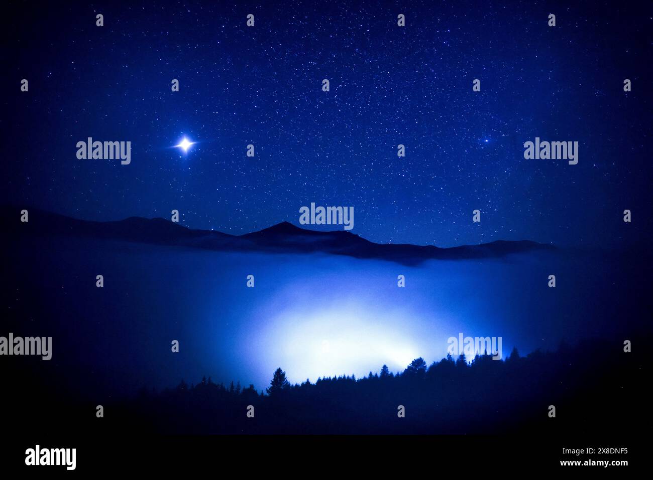 Sky with twinkling stars over mountains at night Stock Photo - Alamy