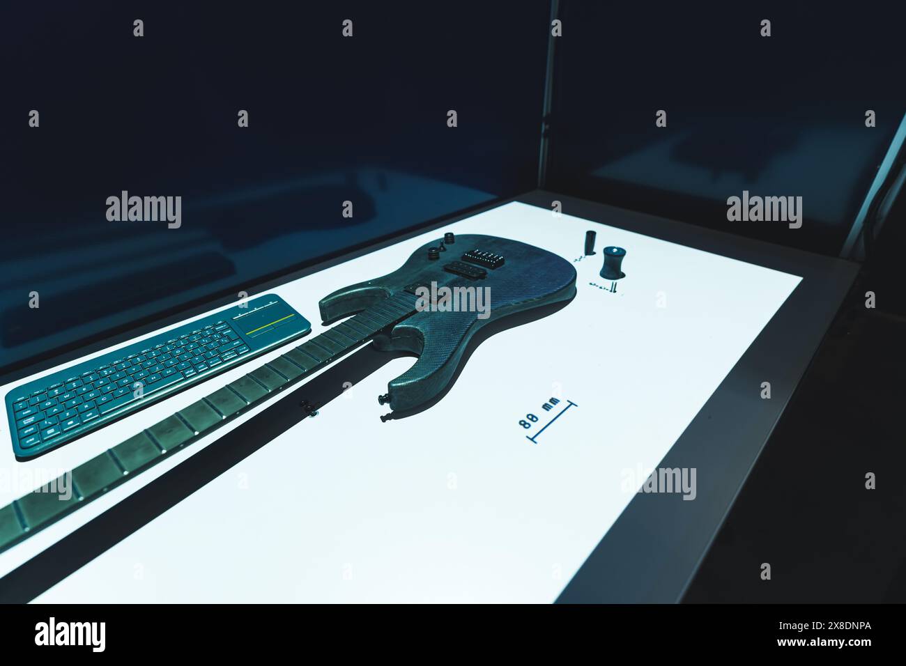 guitar and the computer keyboard on the x ray table, testing the guitar ...