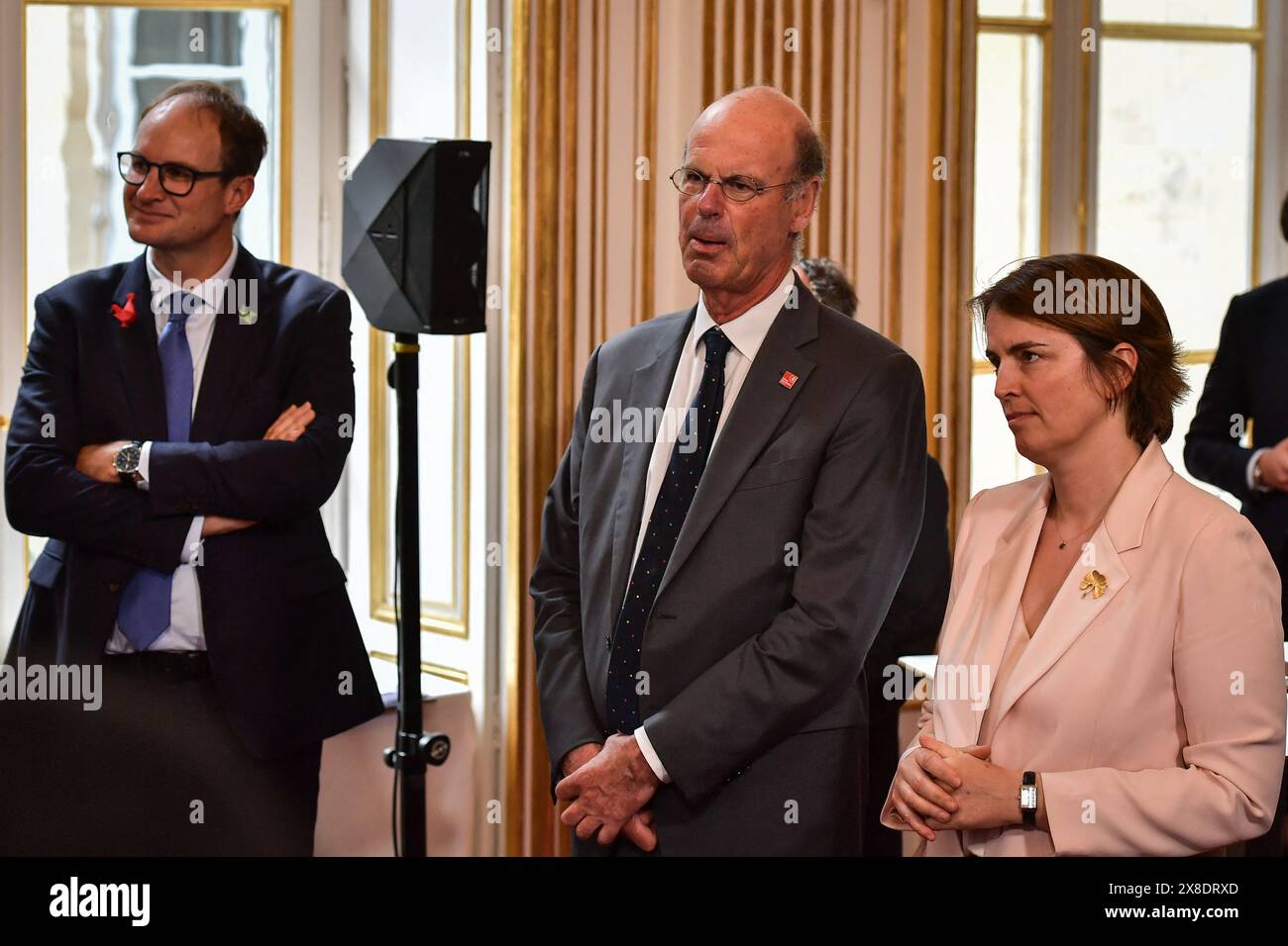 Chief Executive Officer of Caisse des Depots Eric Lombard (C) looks on ...