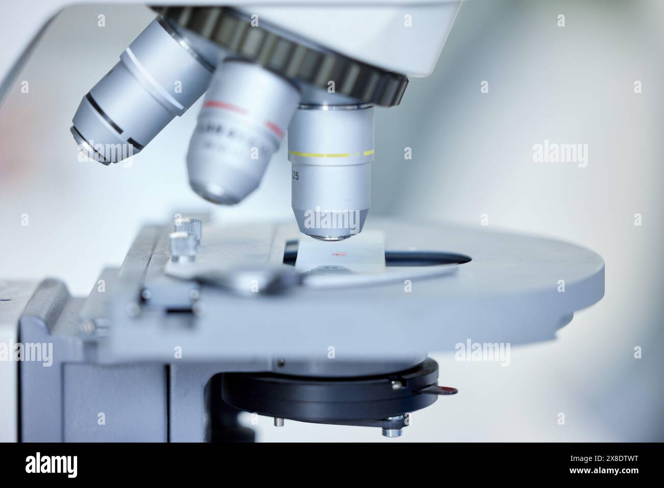 Microscope, closeup laboratory and science with DNA for blood test ...
