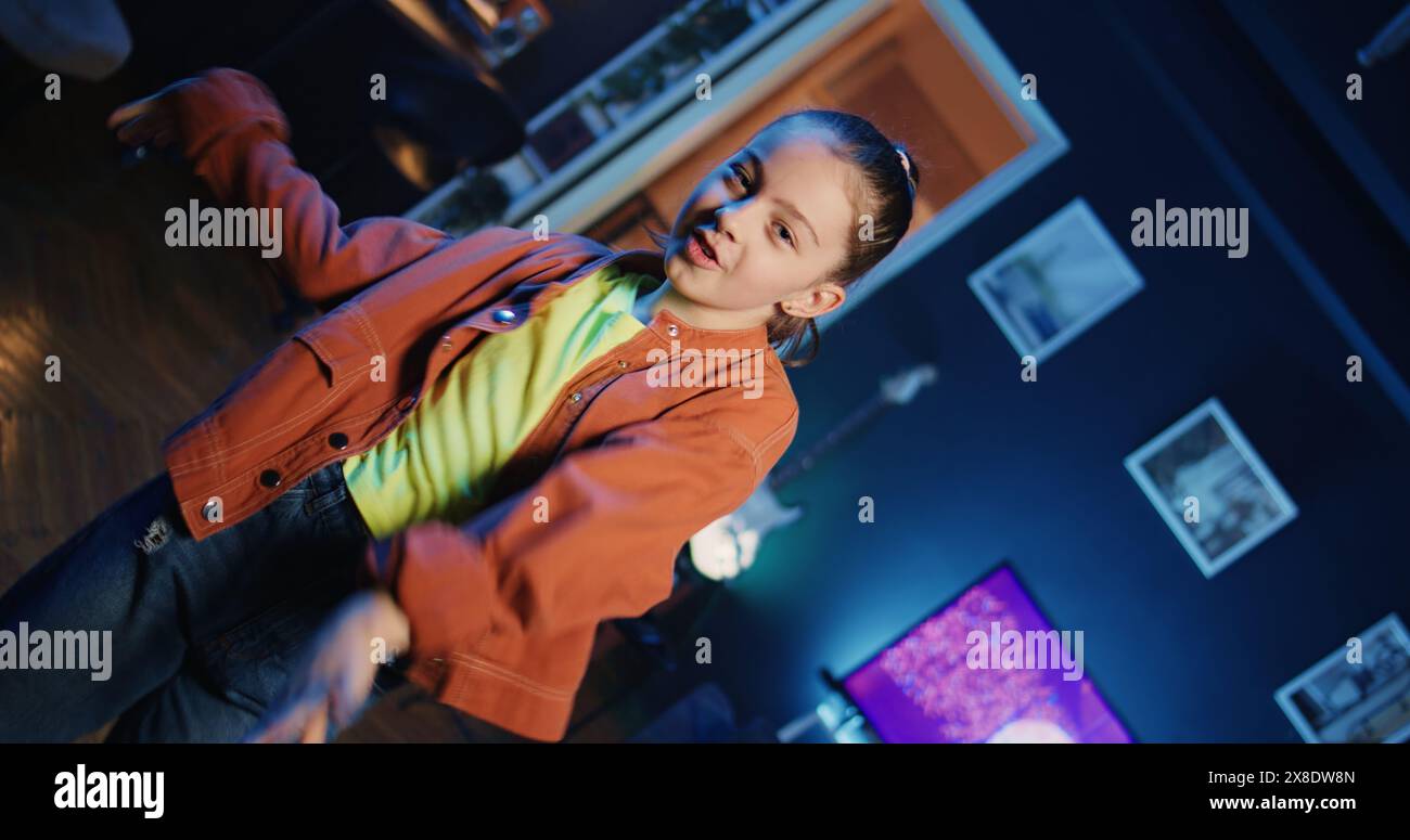 Dutch angle shot on cute girl taking part in trends by sharing content ...