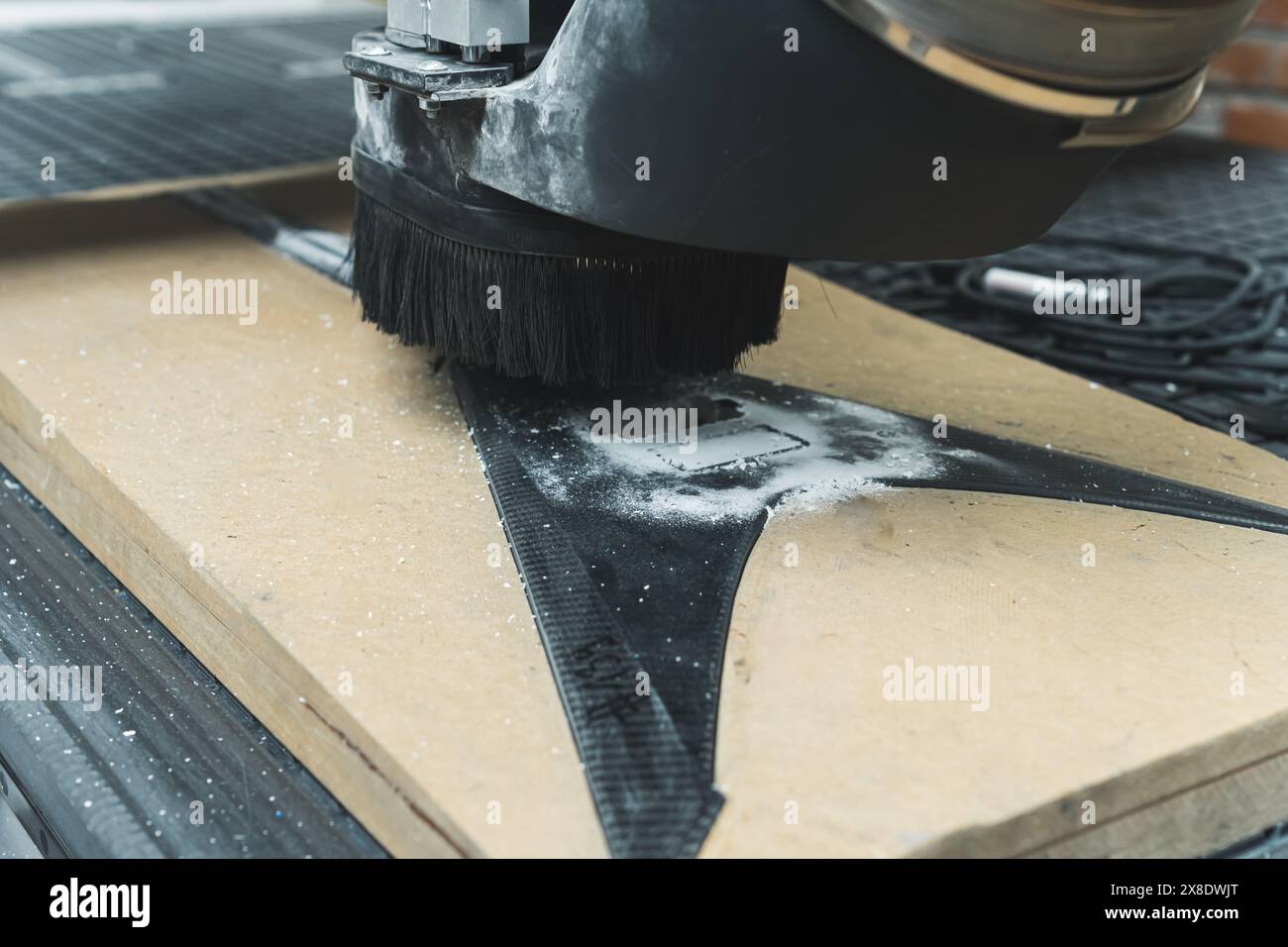 closeup shot of a milling machine working on carbon fiber guitar in the ...