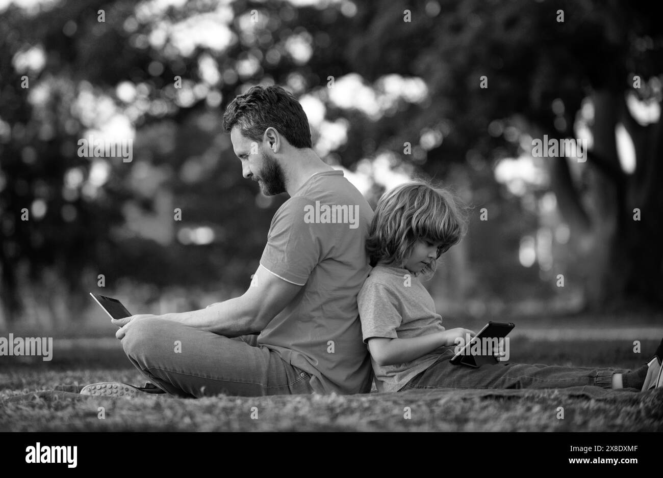 Kid with daddy learning lesson. Father and son use laptop, dad and ...