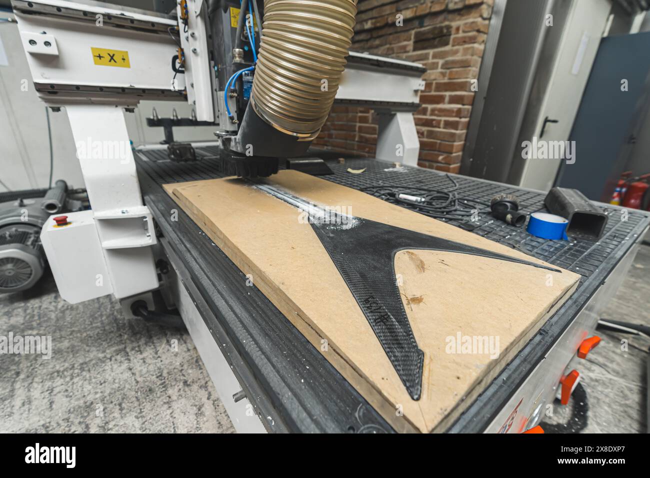 automatic milling machine working on the carbon fiber guitar at the ...
