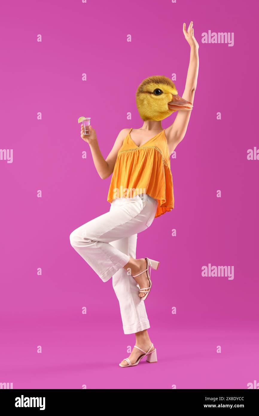 Dancing woman with head of duckling and tequila on magenta background ...