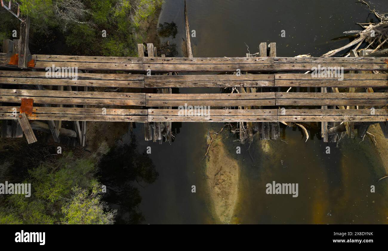 Aerial view of an abandoned disused wooden bridge Stock Photo - Alamy
