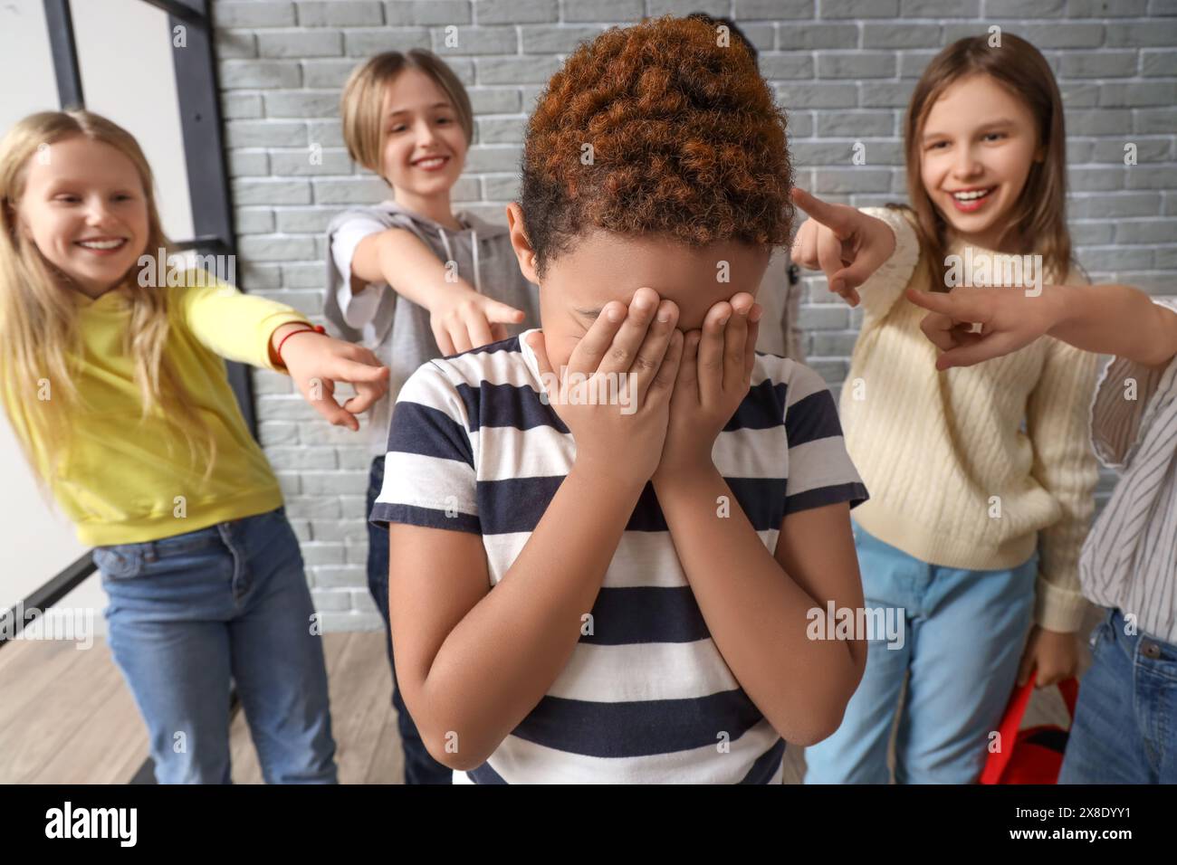 Bullied little African-American boy crying at school, closeup Stock ...