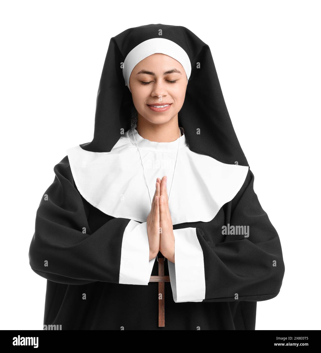Portrait of praying young nun on white background Stock Photo - Alamy