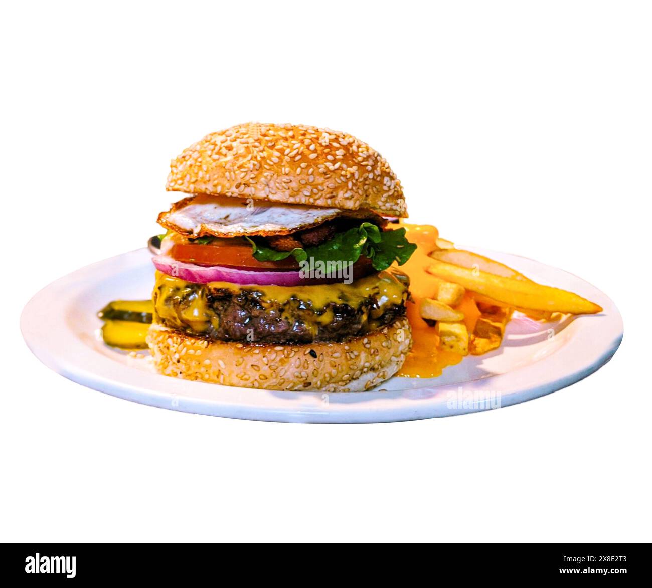 Classic cheeseburger with french fries and pickles. Cheese, tomatoes ...