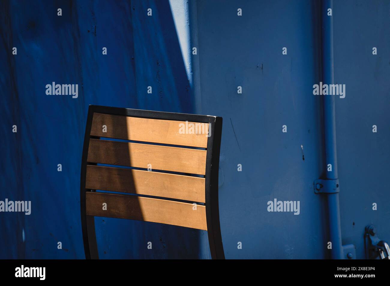A chair back a quarter in shadow Stock Photo - Alamy