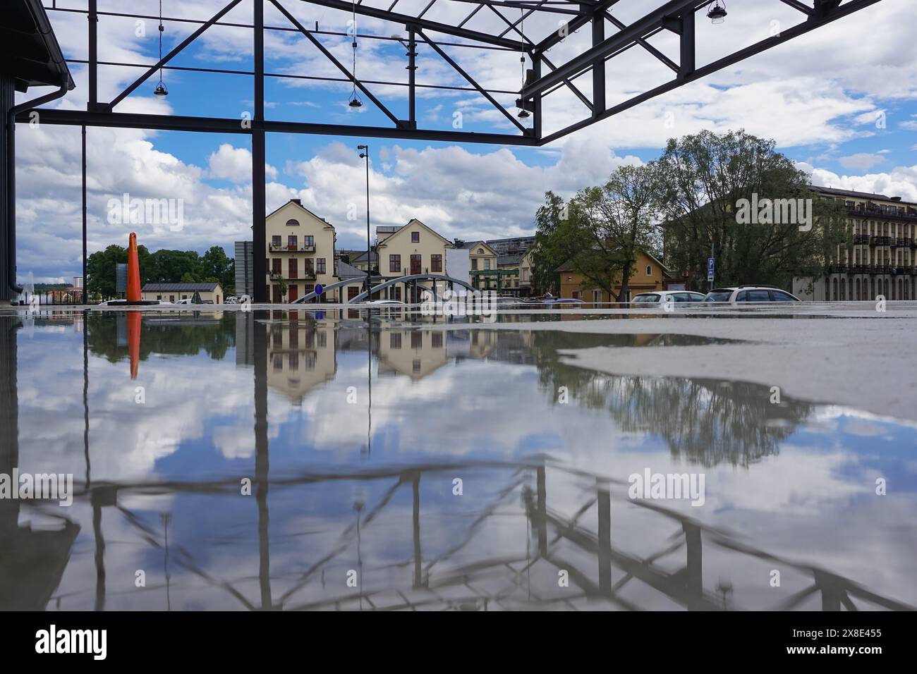Close-up of a puddle of water on a loading dock Stock Photo - Alamy