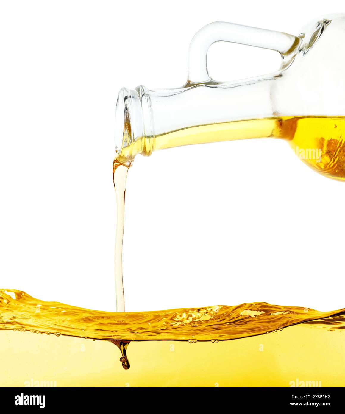Pouring cooking oil from jug on white background, closeup Stock Photo ...