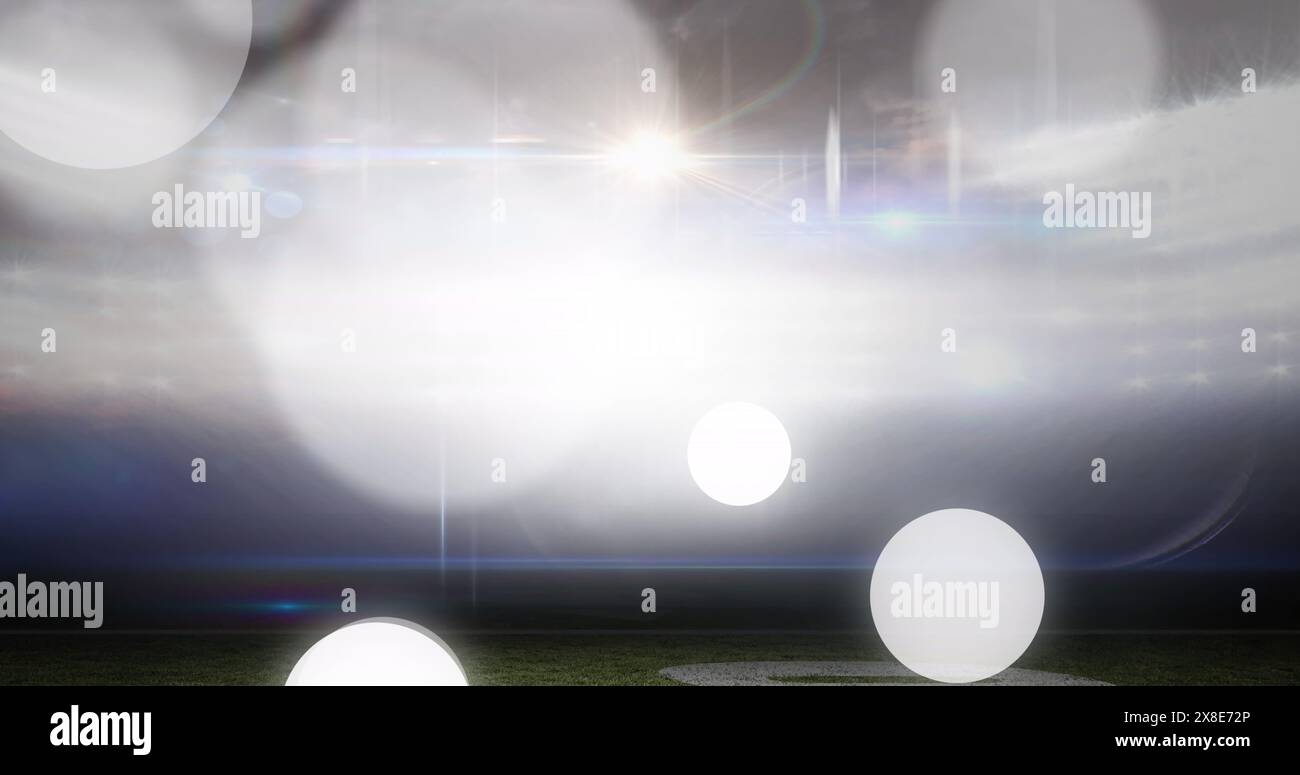 Image of white spots of light falling over glowing lights Stock Photo ...