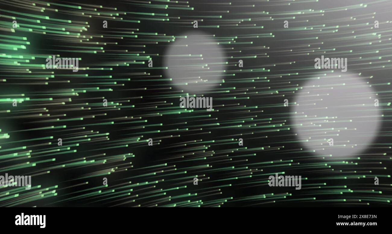 Image of spots of light over green light trails Stock Photo - Alamy