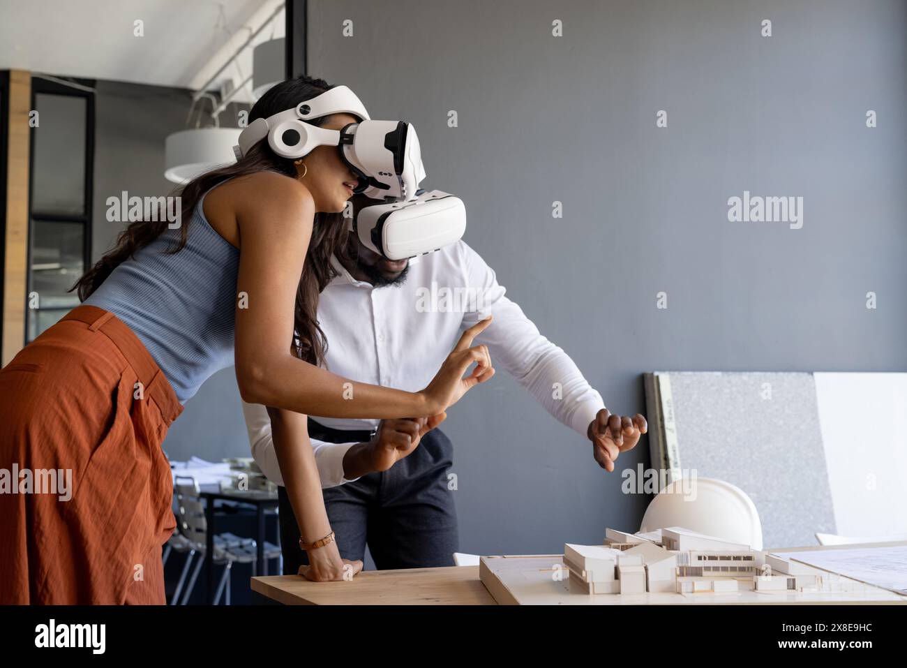 Diverse team working with virtual reality headsets in modern office ...