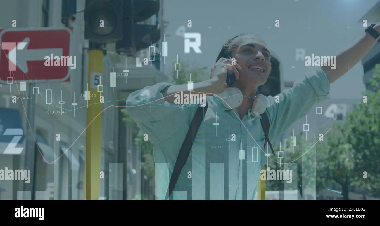 Image of graphs , changing number, biracial man calling on cellphone ...