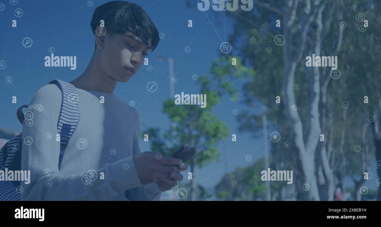 Image of changing numbers and connected icons over biracial man using cellphone Stock Photo - Alamy