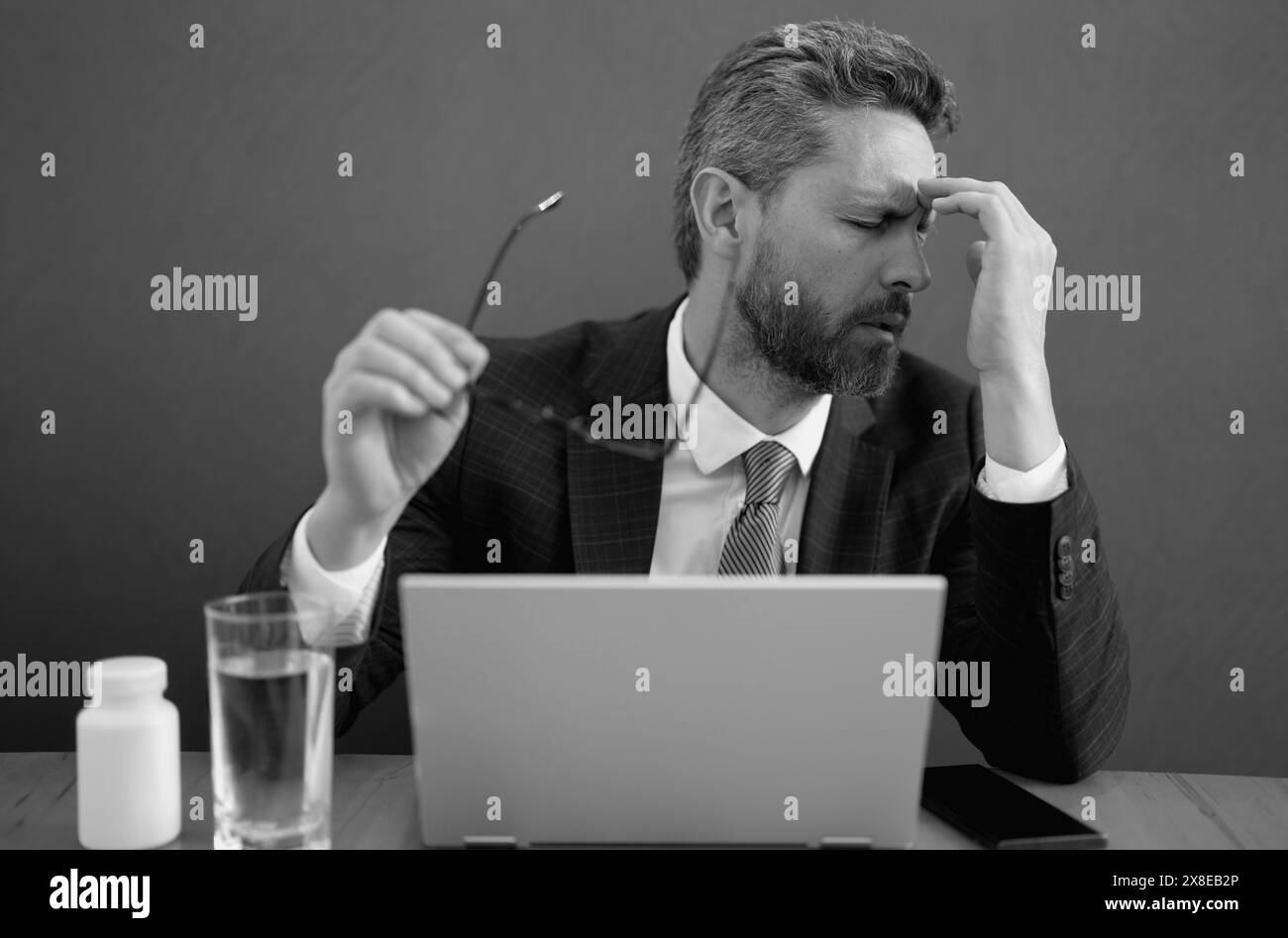 Business man feel pain holding glasses rubbing dry irritated eyes ...