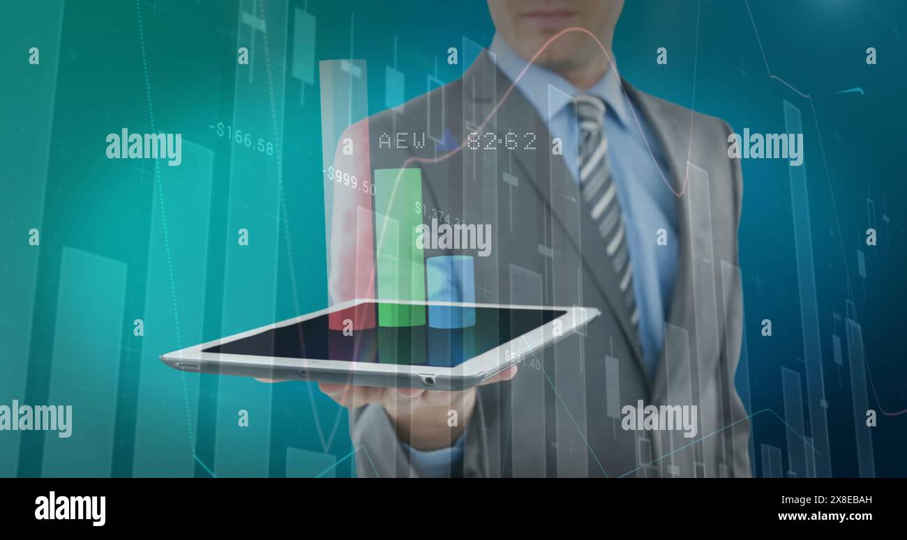 Man in suit holding tablet, displaying graphs, standing Stock Photo - Alamy