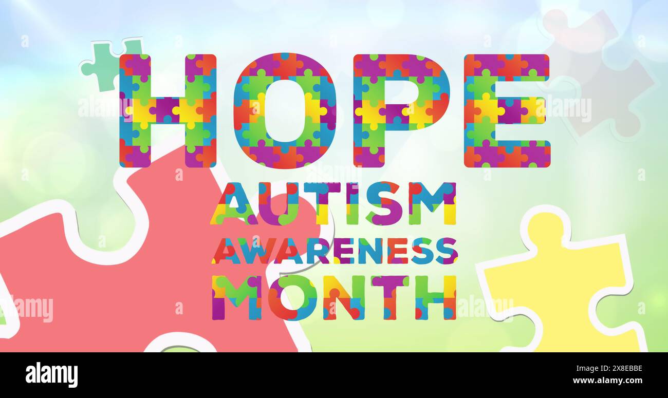 Colorful puzzle pieces spell HOPE and AUTISM AWARENESS MONTH on a vivid ...