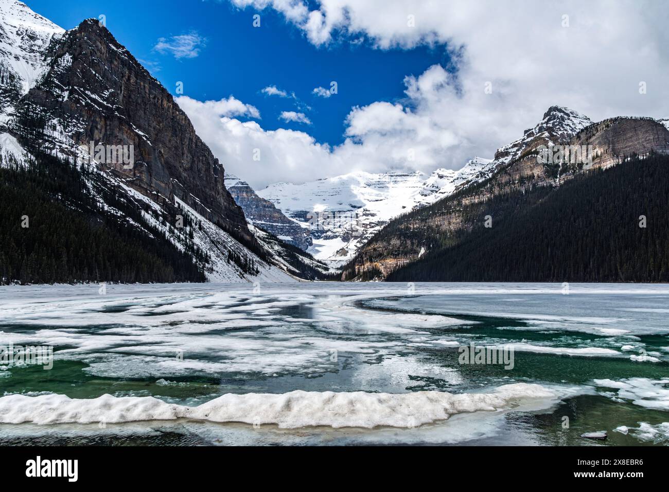 Ice begins to thaw on glacier-fed Lake Louise in Banff National Park in ...