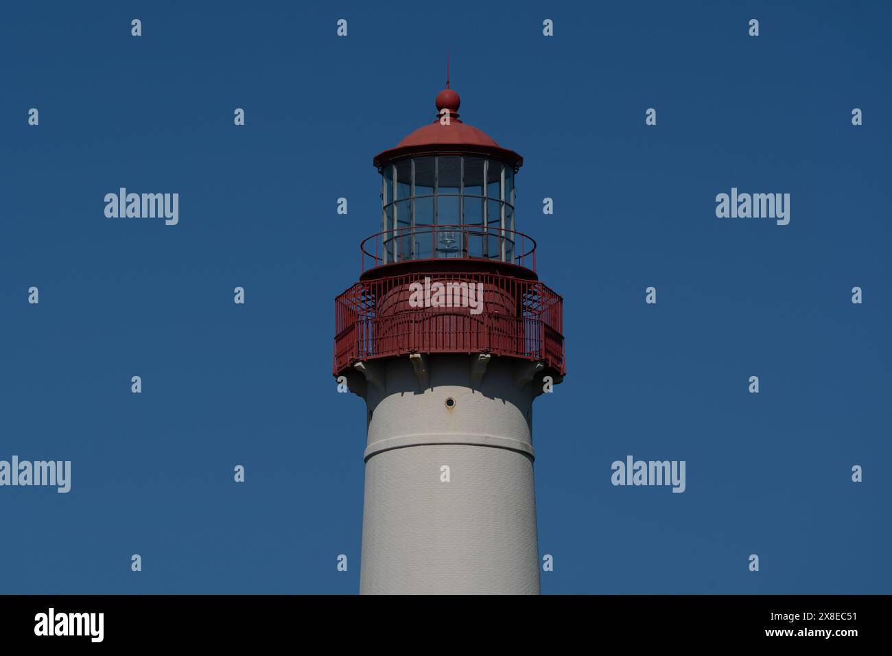 Cape May Lighthouse against a blue sky background Stock Photo - Alamy