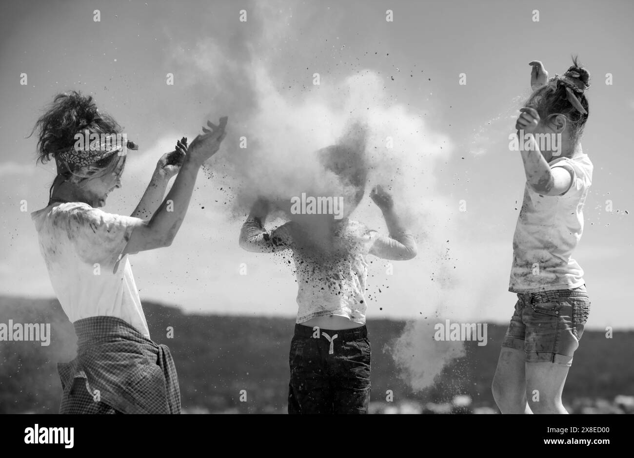 Funny kids in summer. Colored splash powder and color dust Stock Photo ...