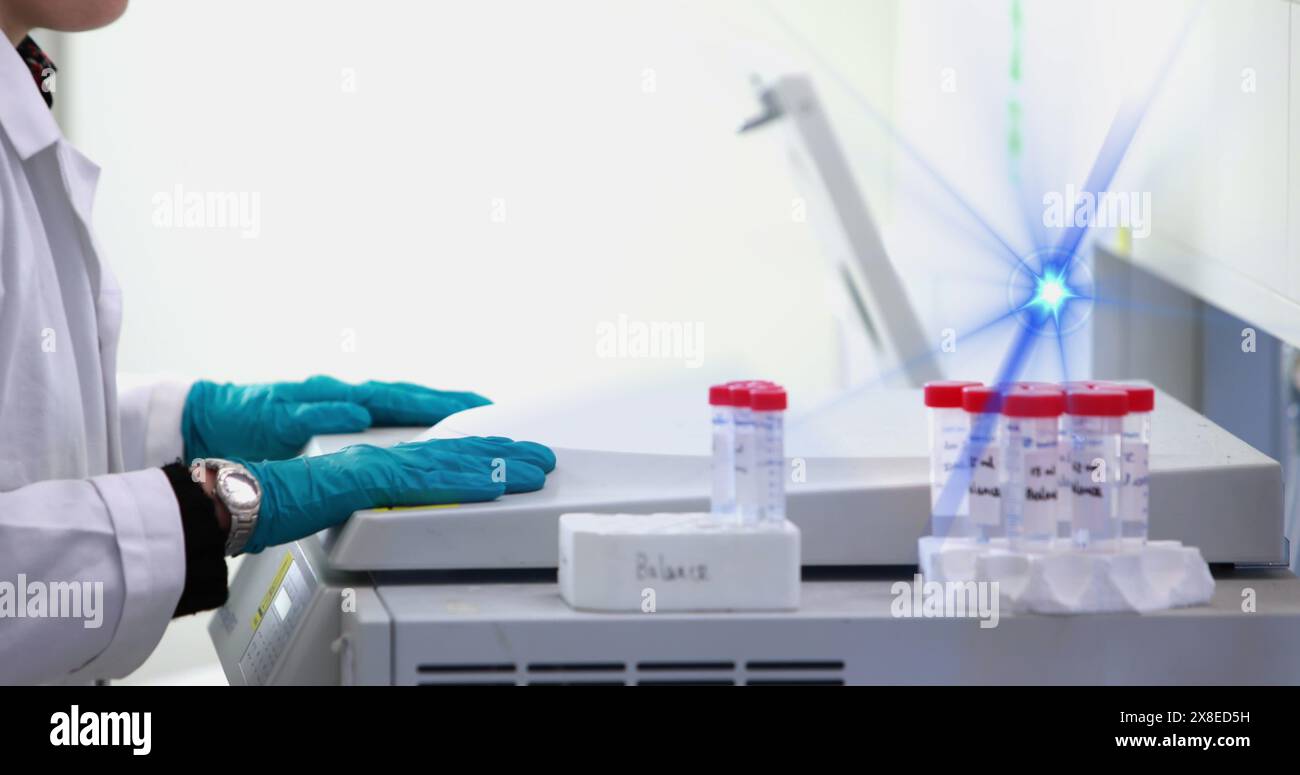 Scientist examining sample microscope hi-res stock photography and ...