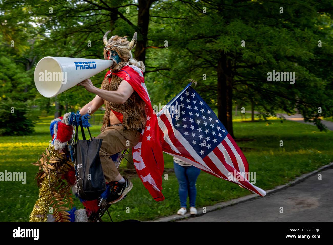 New York, New York, USA. 18th May, 2024. A man dressed as the Qanon ...