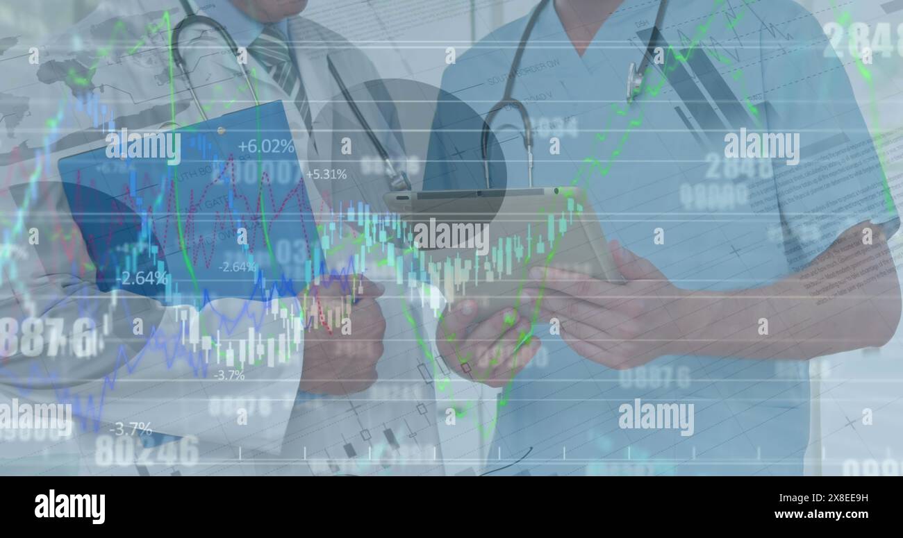 Image of financial data processing over diverse doctors Stock Photo - Alamy