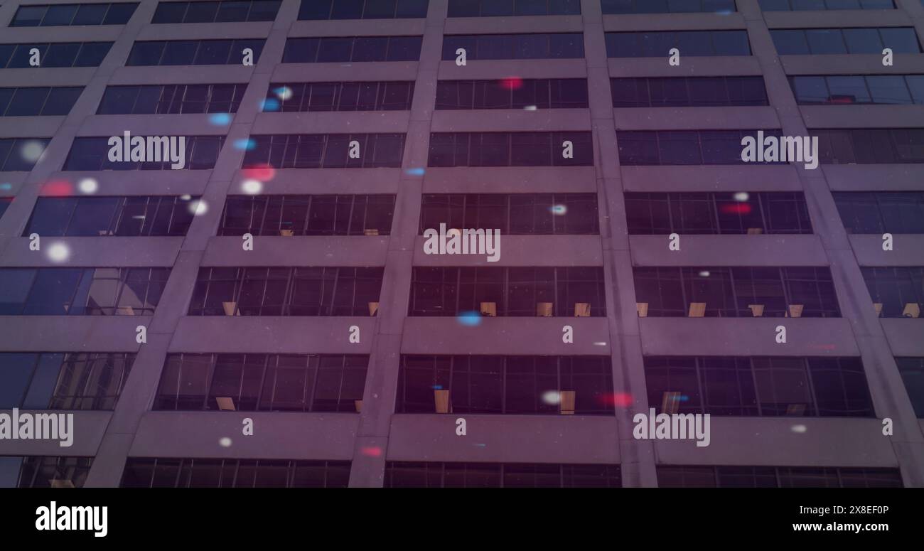 Image of red blue and white spots over building Stock Photo - Alamy